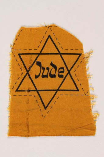 Unused yellow cloth Star of David badge with Jude printed in the center ...